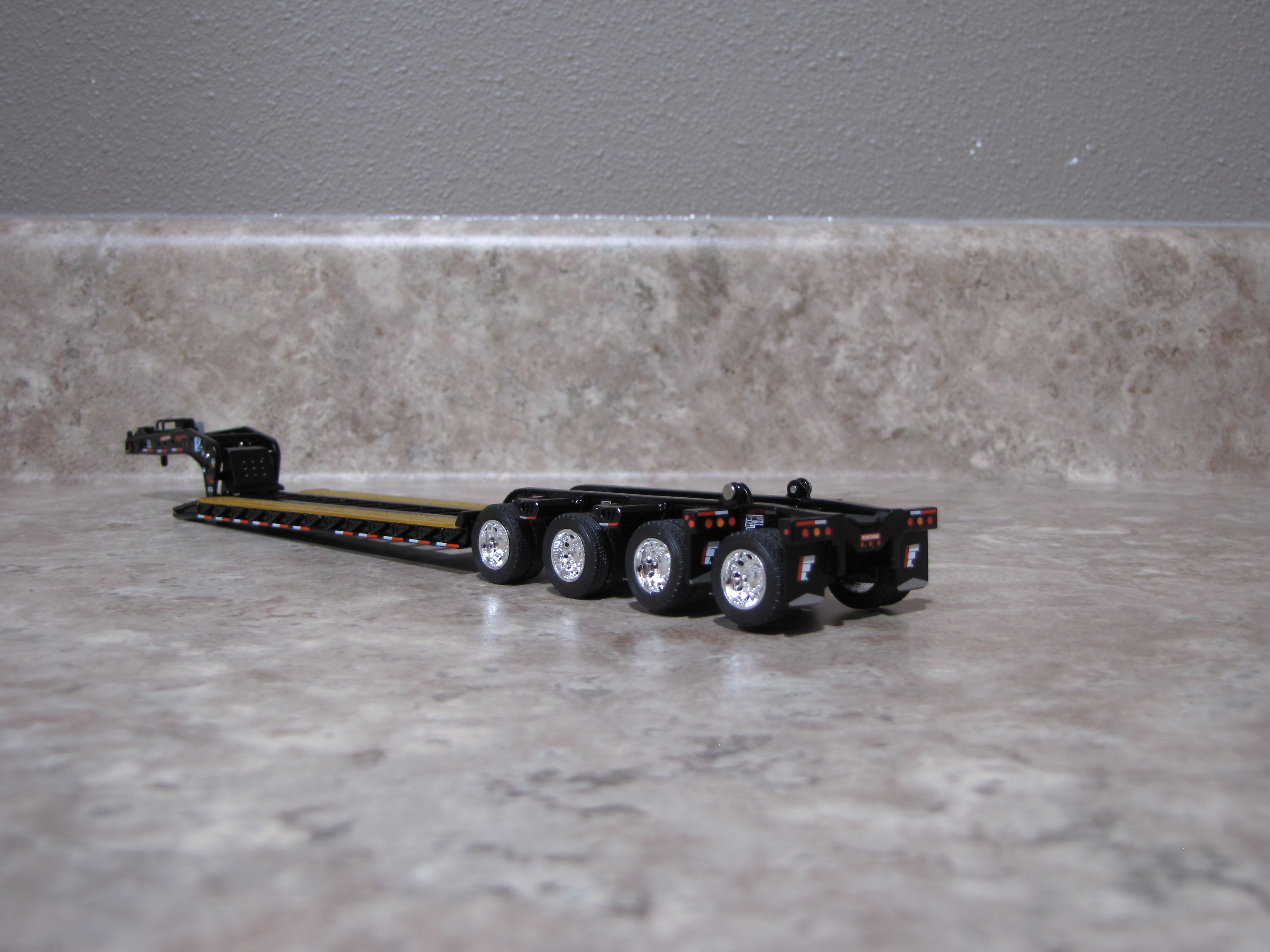 TRL1476 Black Fontaine Magnitude Lowboy Trailer w Flip Axle – JW Toy Trucks